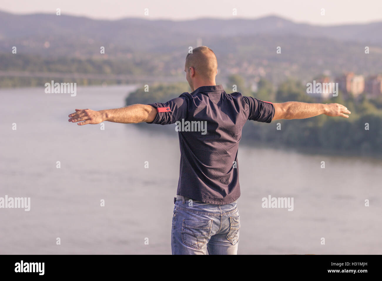 Man standing back view hi-res stock photography and images - Alamy