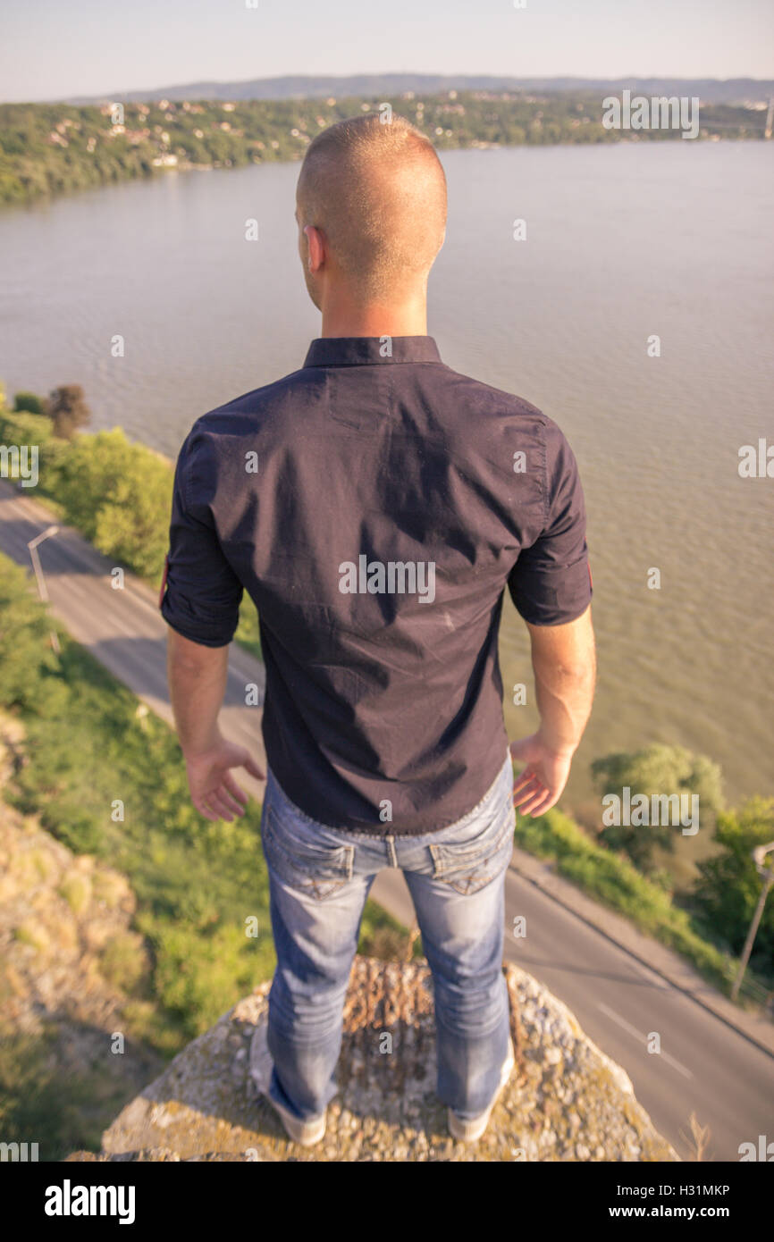 Man standing back view hi-res stock photography and images - Alamy