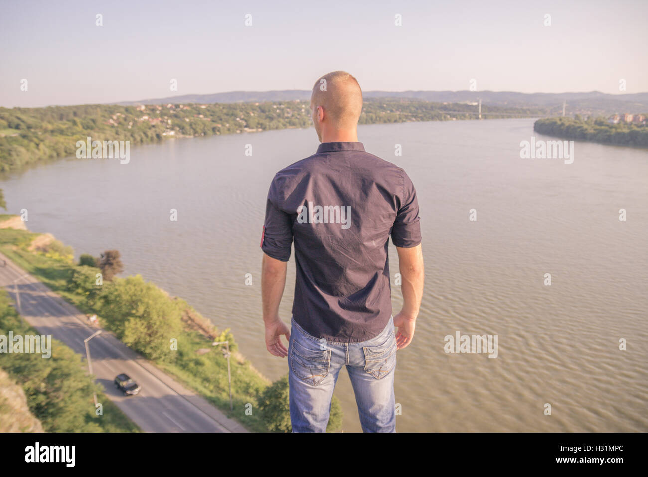 Man standing back view hi-res stock photography and images - Alamy