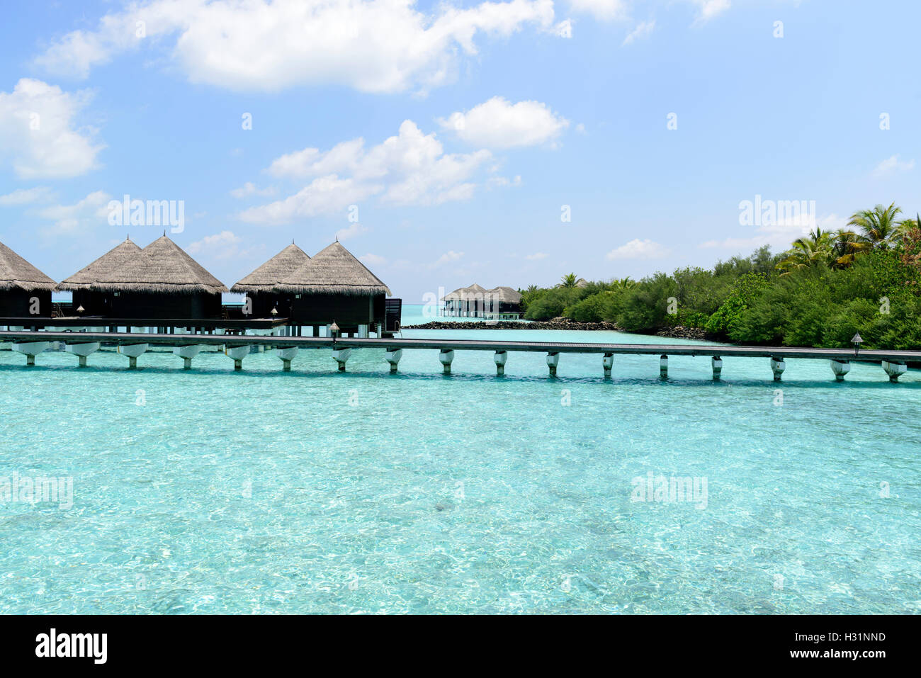 houses on piles on sea. Maldives Stock Photo - Alamy