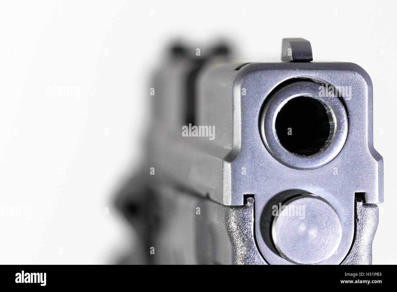 Closeup of end of pistol barrel Stock Photo - Alamy
