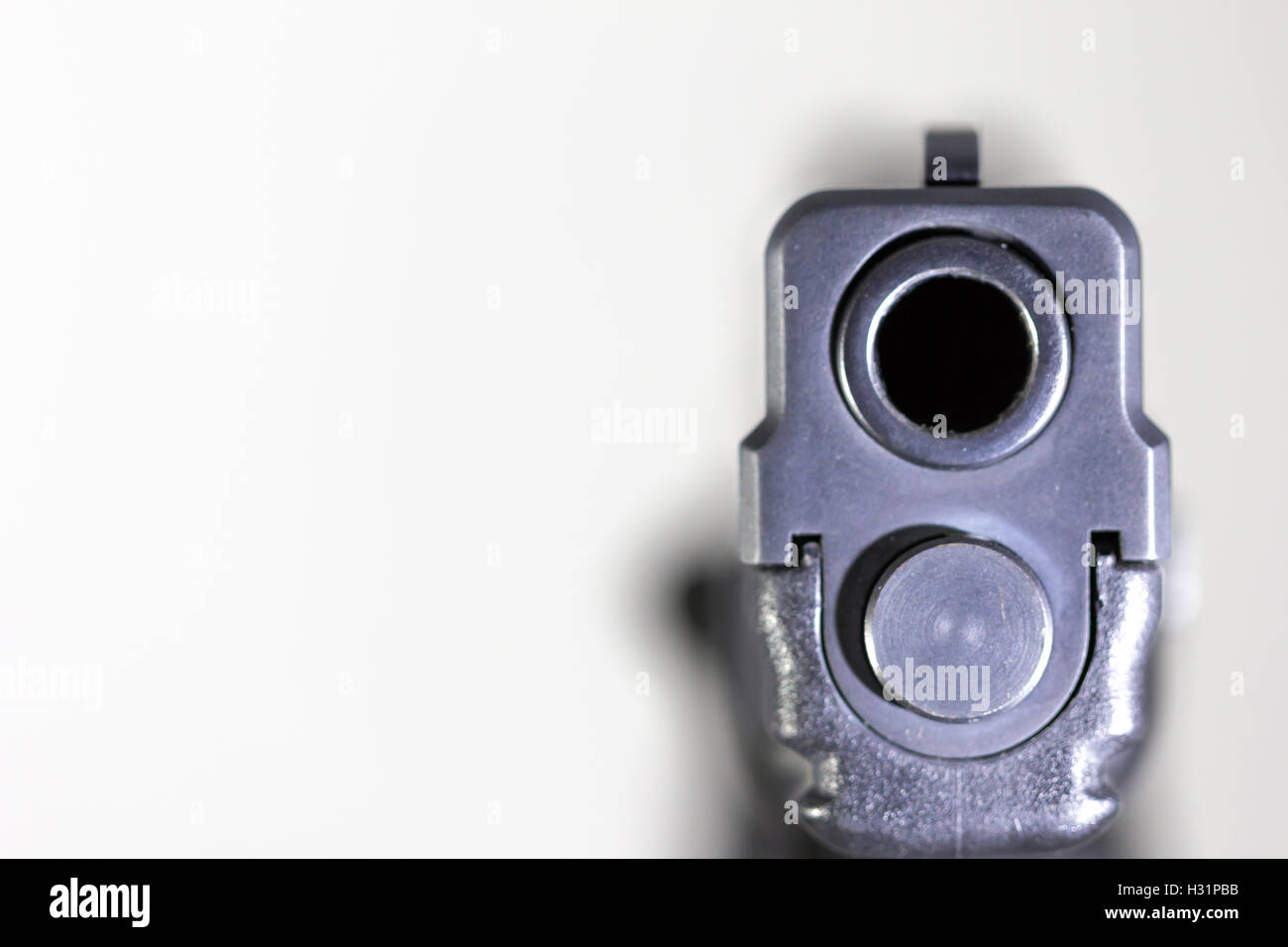 Closeup of end of pistol barrell Stock Photo - Alamy