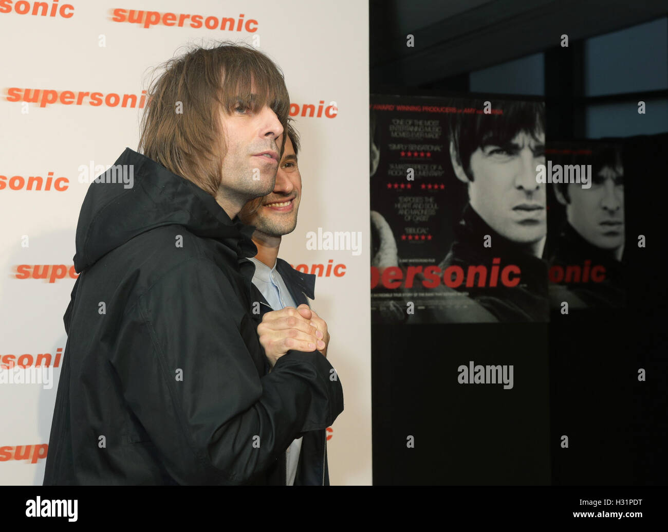 Liam Gallagher (left) and director Mat Whitecross arriving for a ...