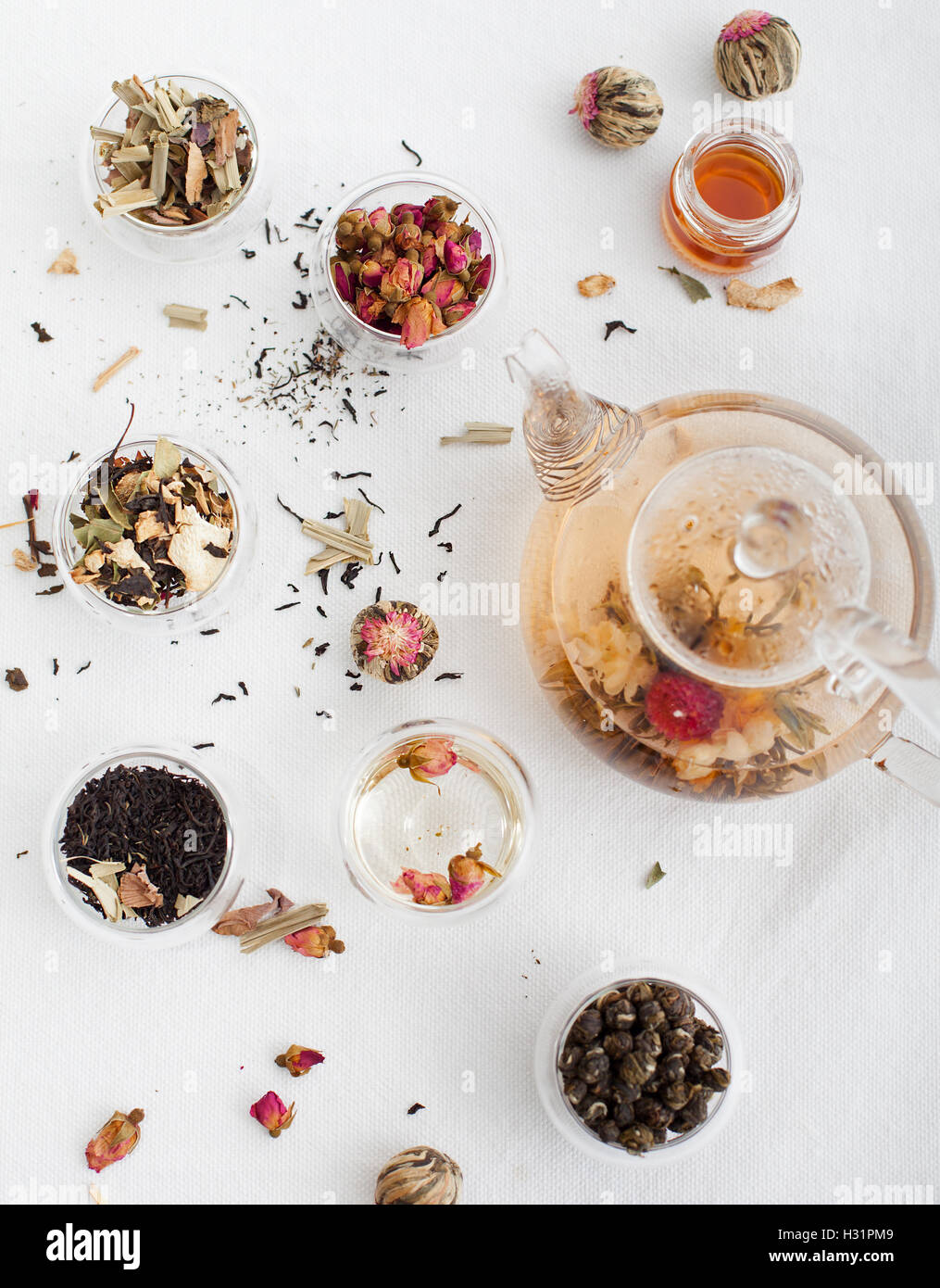 Traditional asian floral tea in a glass teapot Stock Photo - Alamy