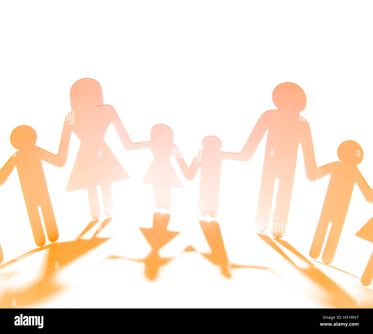 Family paper chain cutout holding hands Stock Photo - Alamy