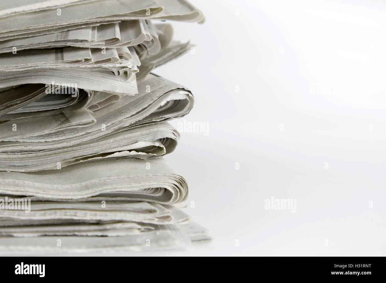 Closeup of pile of newspapers Stock Photo - Alamy