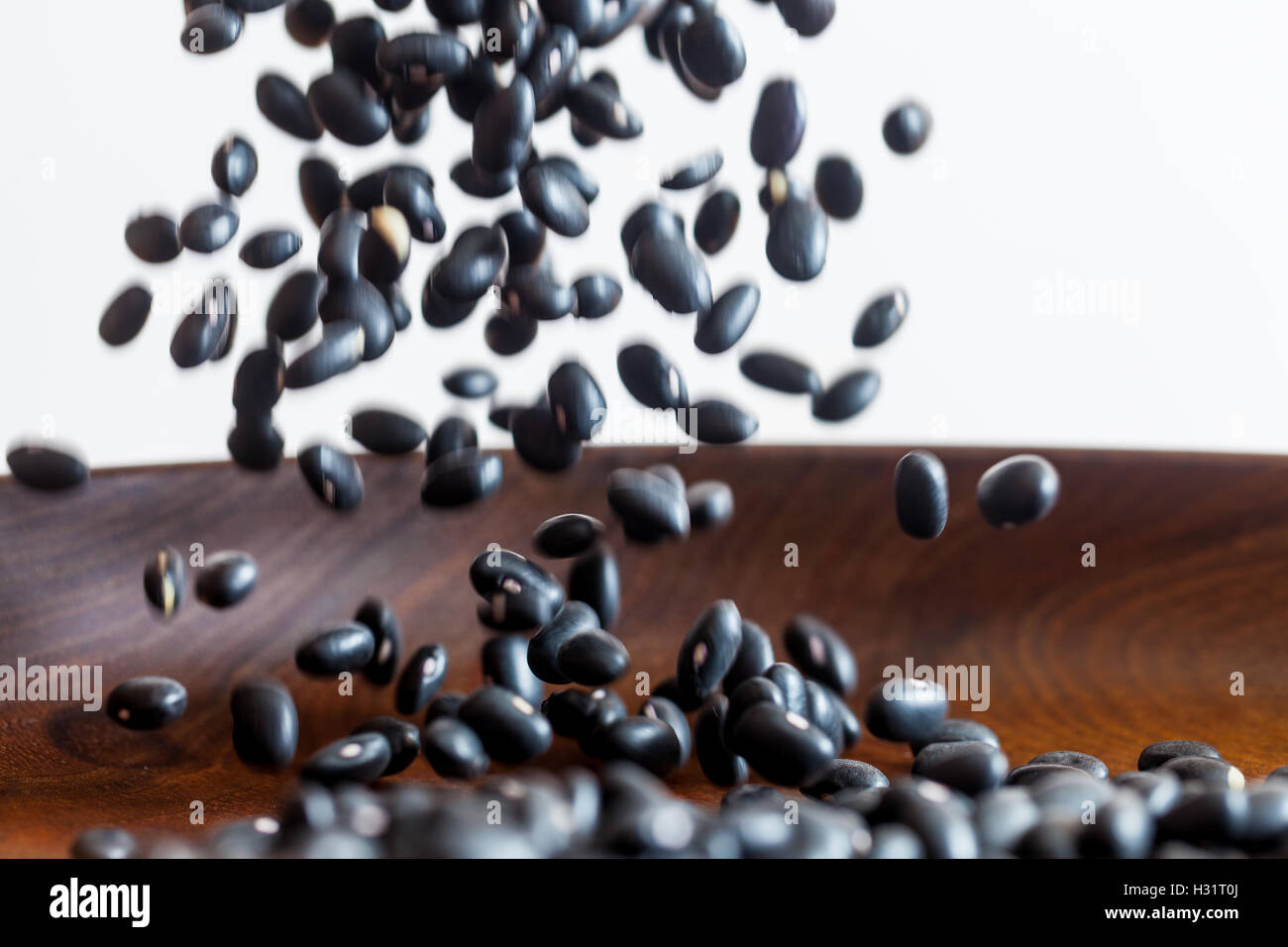 Dried Black Beans Falling Stock Photo - Alamy