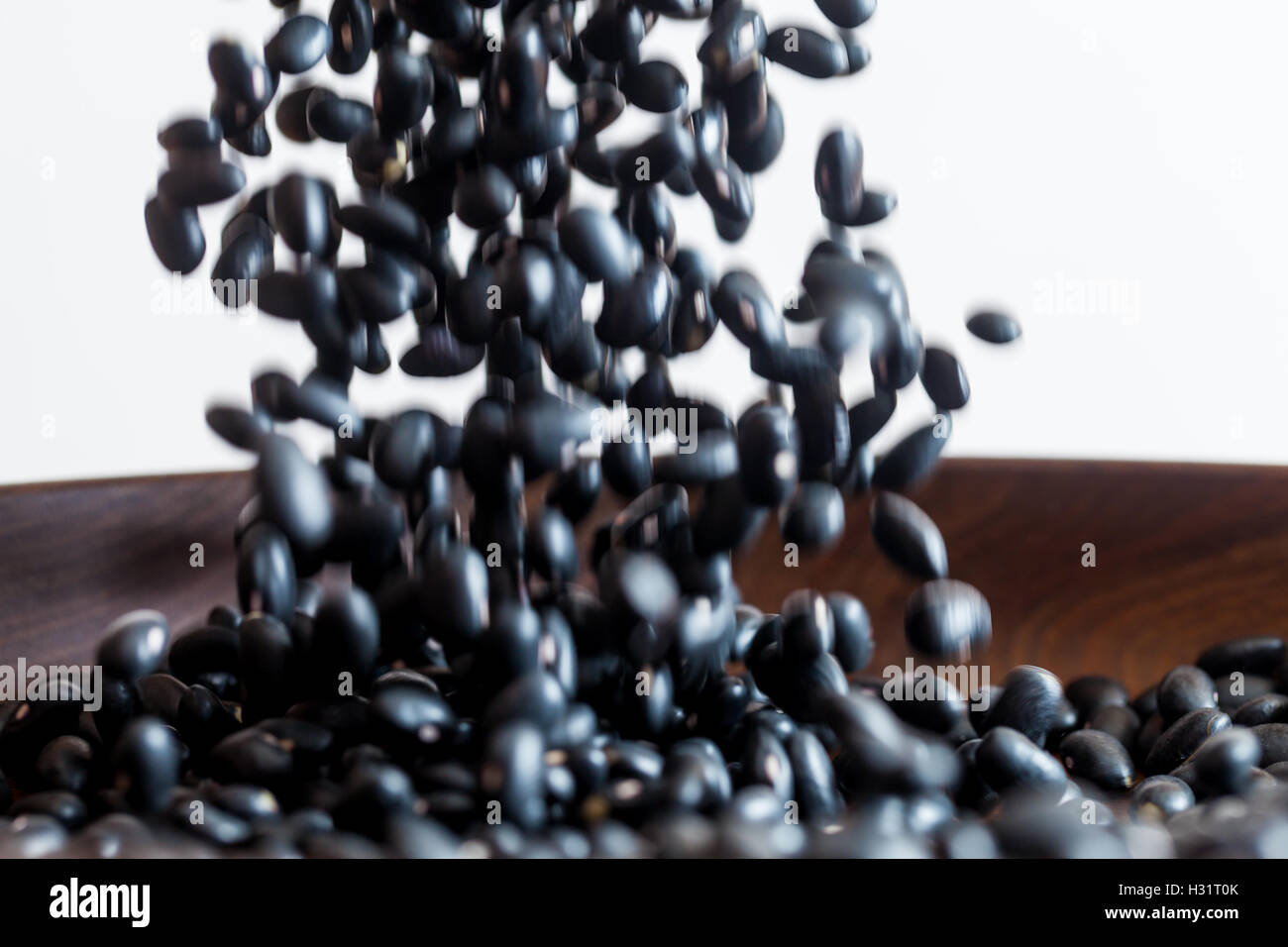 Dried Black Beans Falling Stock Photo - Alamy