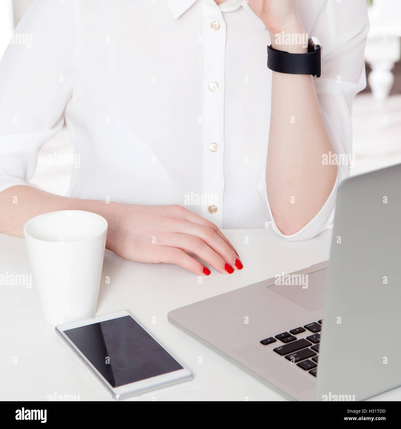 Top view of woman hand with smartwatch. with keyboard of laptop and ...