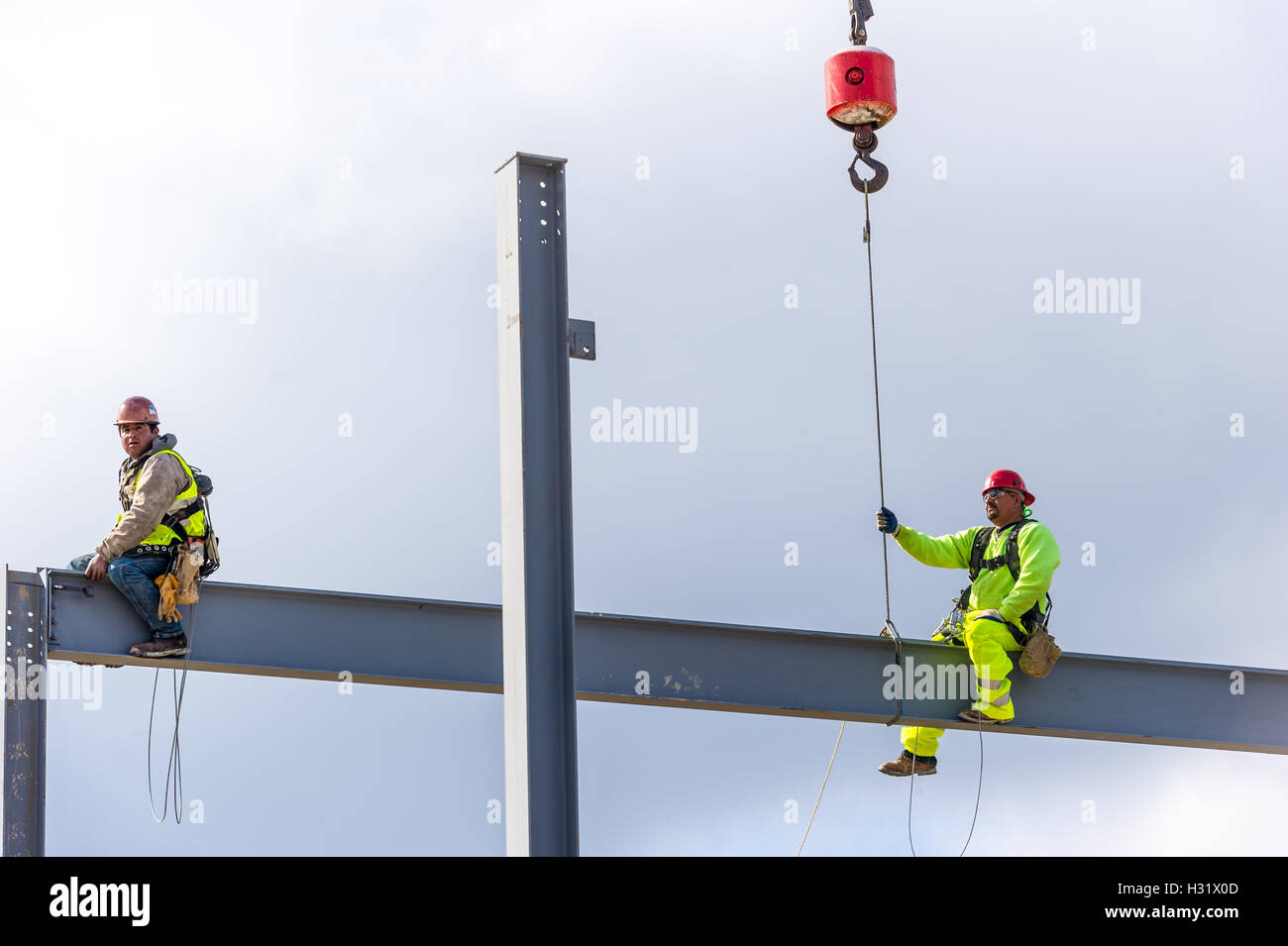 Workers sitting on beam hi-res stock photography and images - Alamy