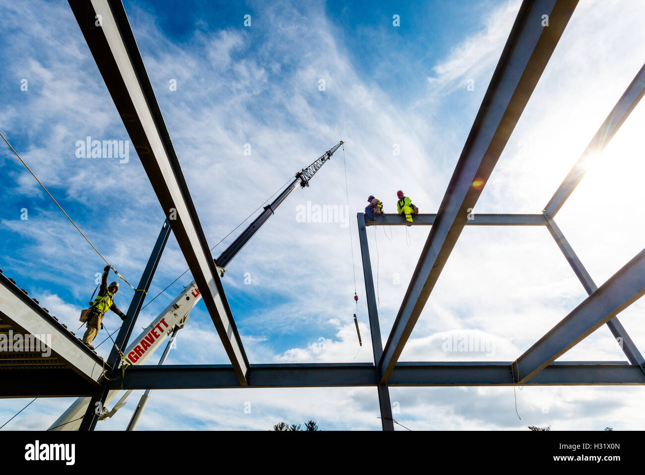 Workers Sitting On Beam