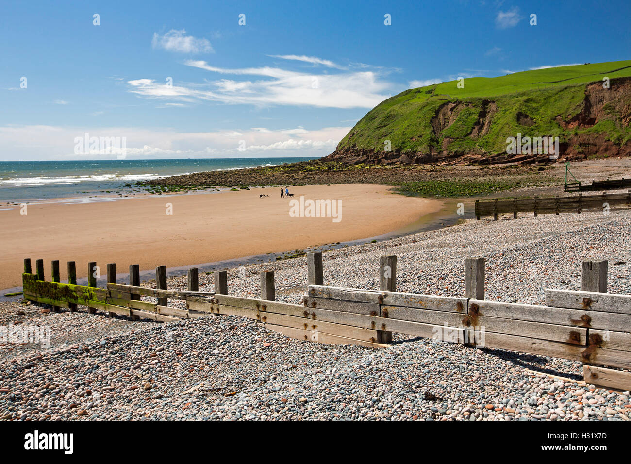Ocean and beach with both sandy and shingle sections at base of high ...