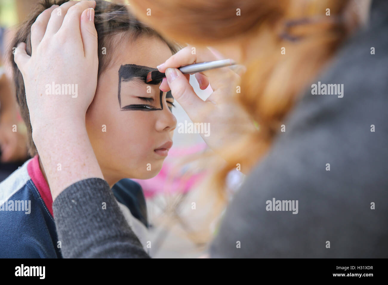 Boy painted face hi-res stock photography and images - Alamy