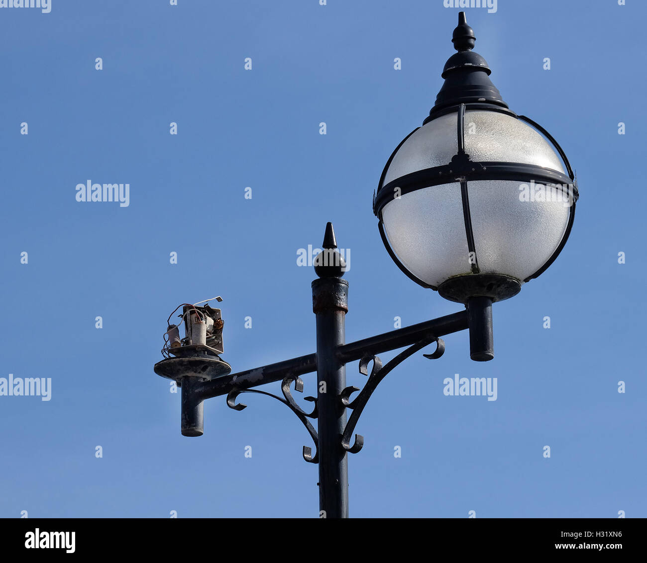 Light fitting with one intact and one broken unit Stock Photo - Alamy