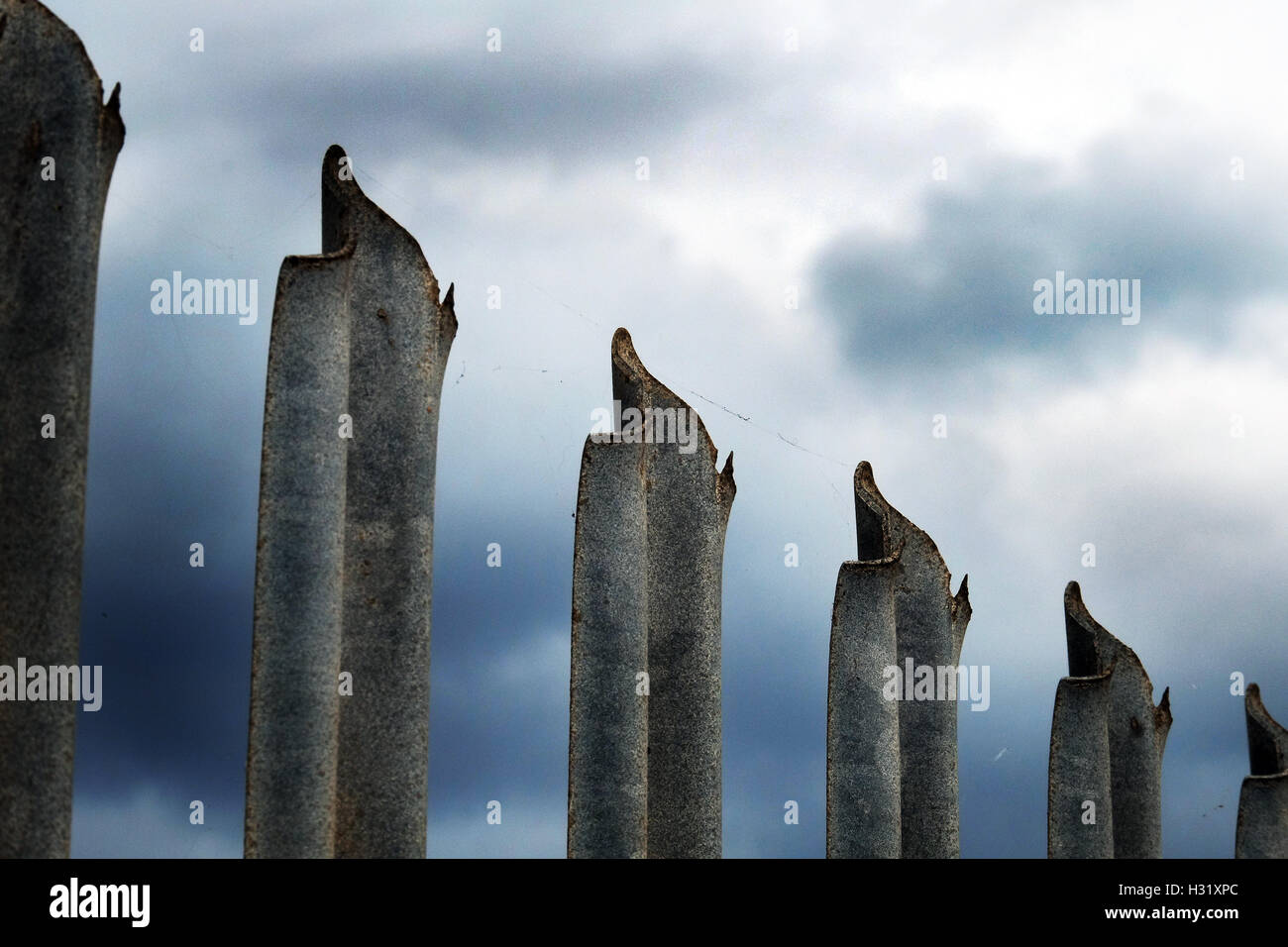 Steel galvanized fence posts with sharp spiked top to prevent access ...
