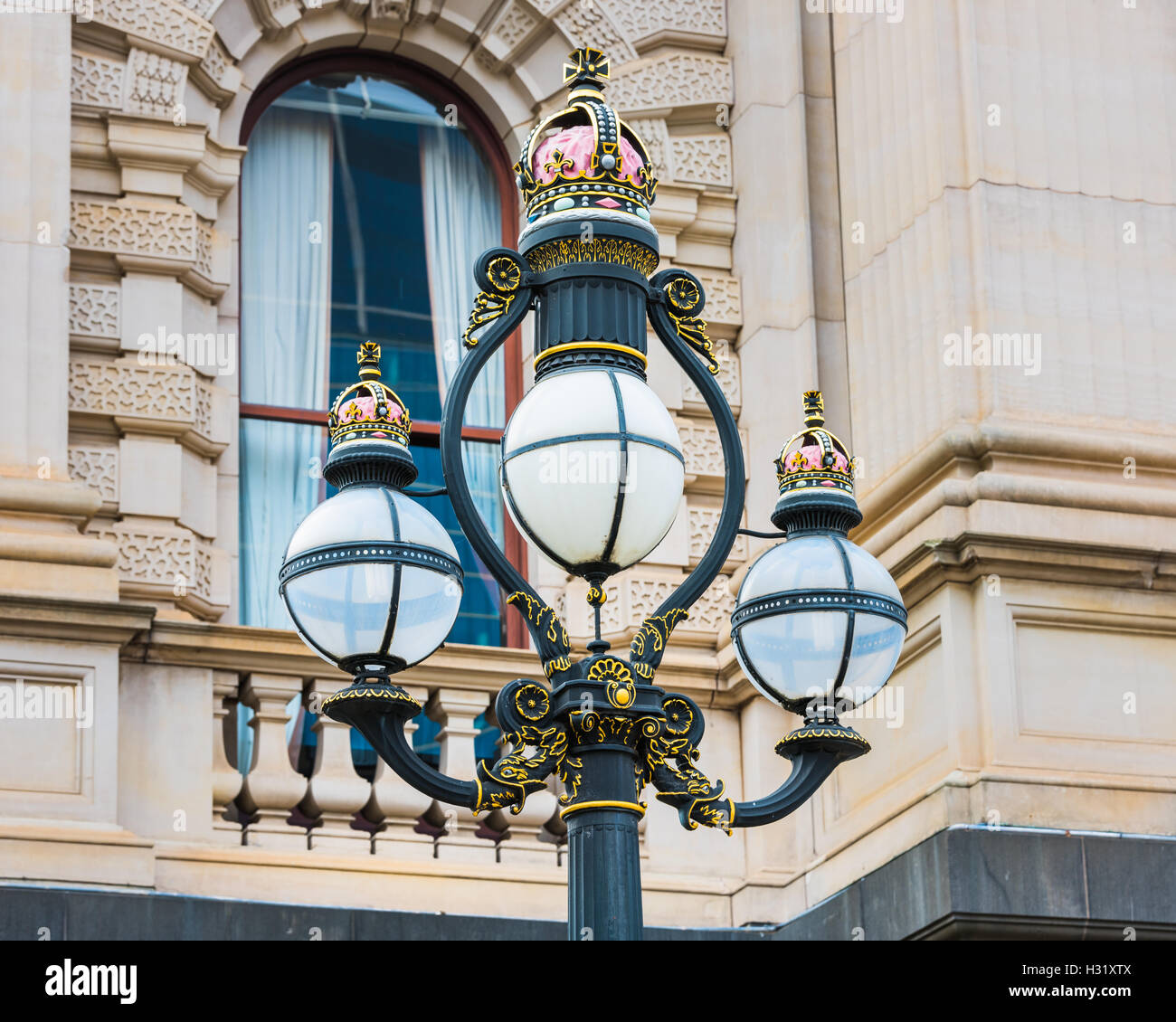 Low angle view of an ornate street light outside the parliament ...
