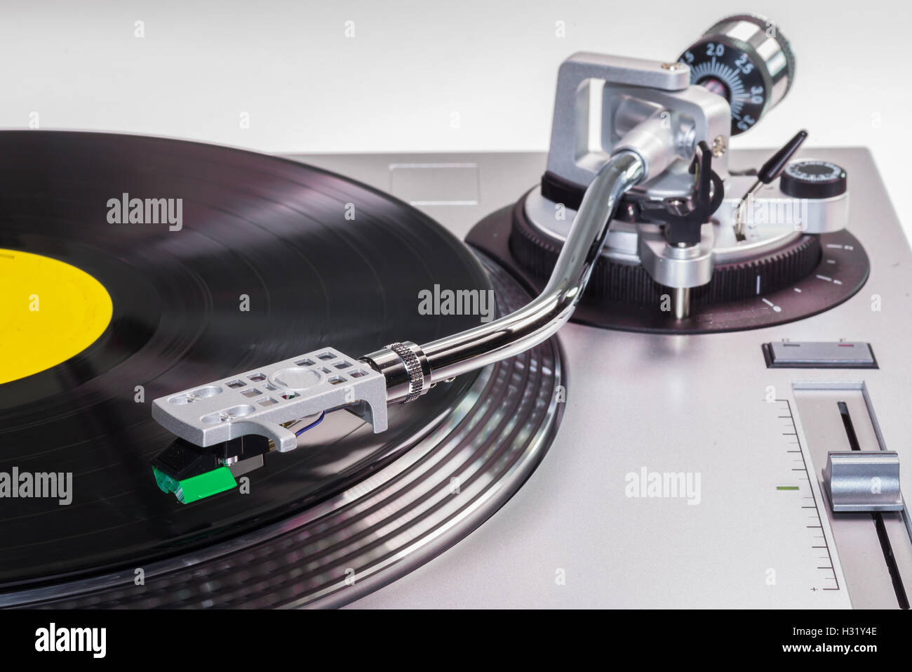 A record player playing a vinyl record Stock Photo - Alamy