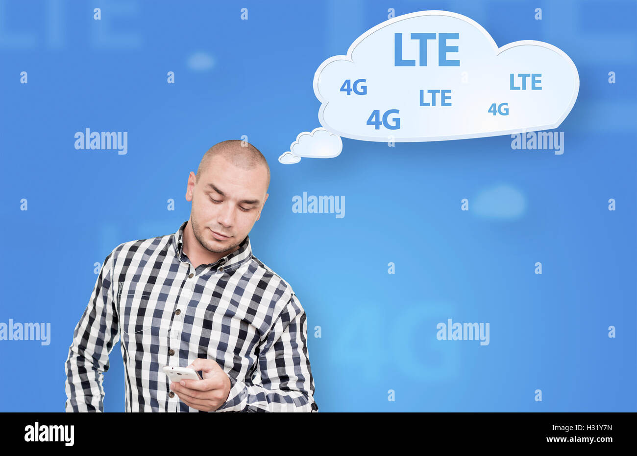 Handsome man thinking about mobile internet connection Stock Photo - Alamy