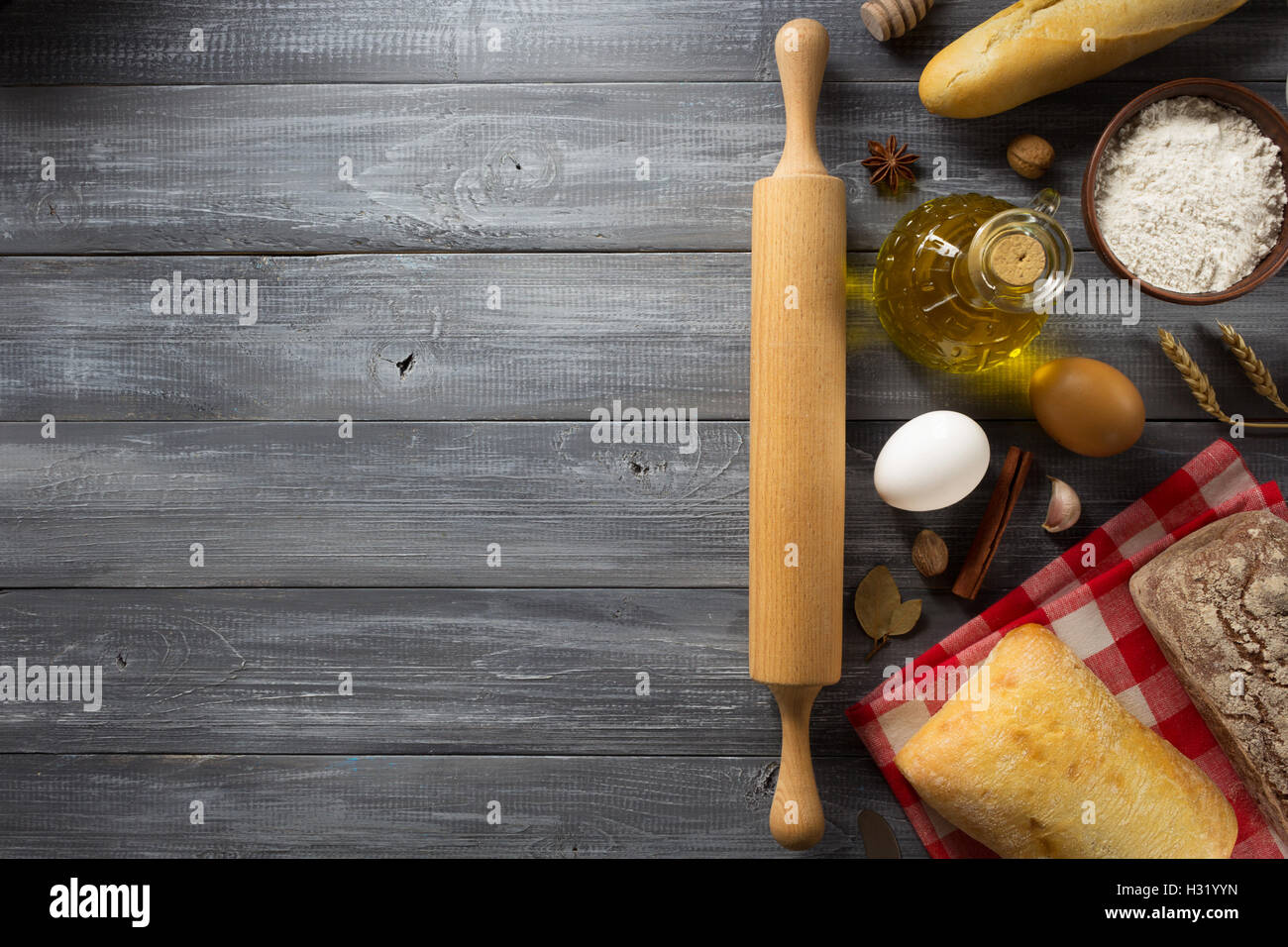 bread and bakery products on wood background Stock Photo - Alamy