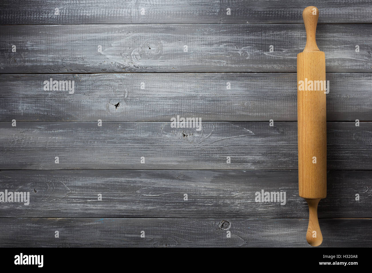 rolling pin on wooden background Stock Photo - Alamy