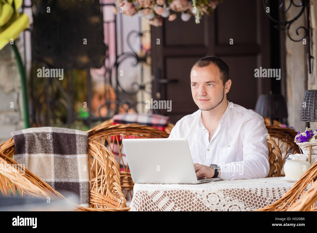 Young man internet browsing at the cafe bar Stock Photo - Alamy