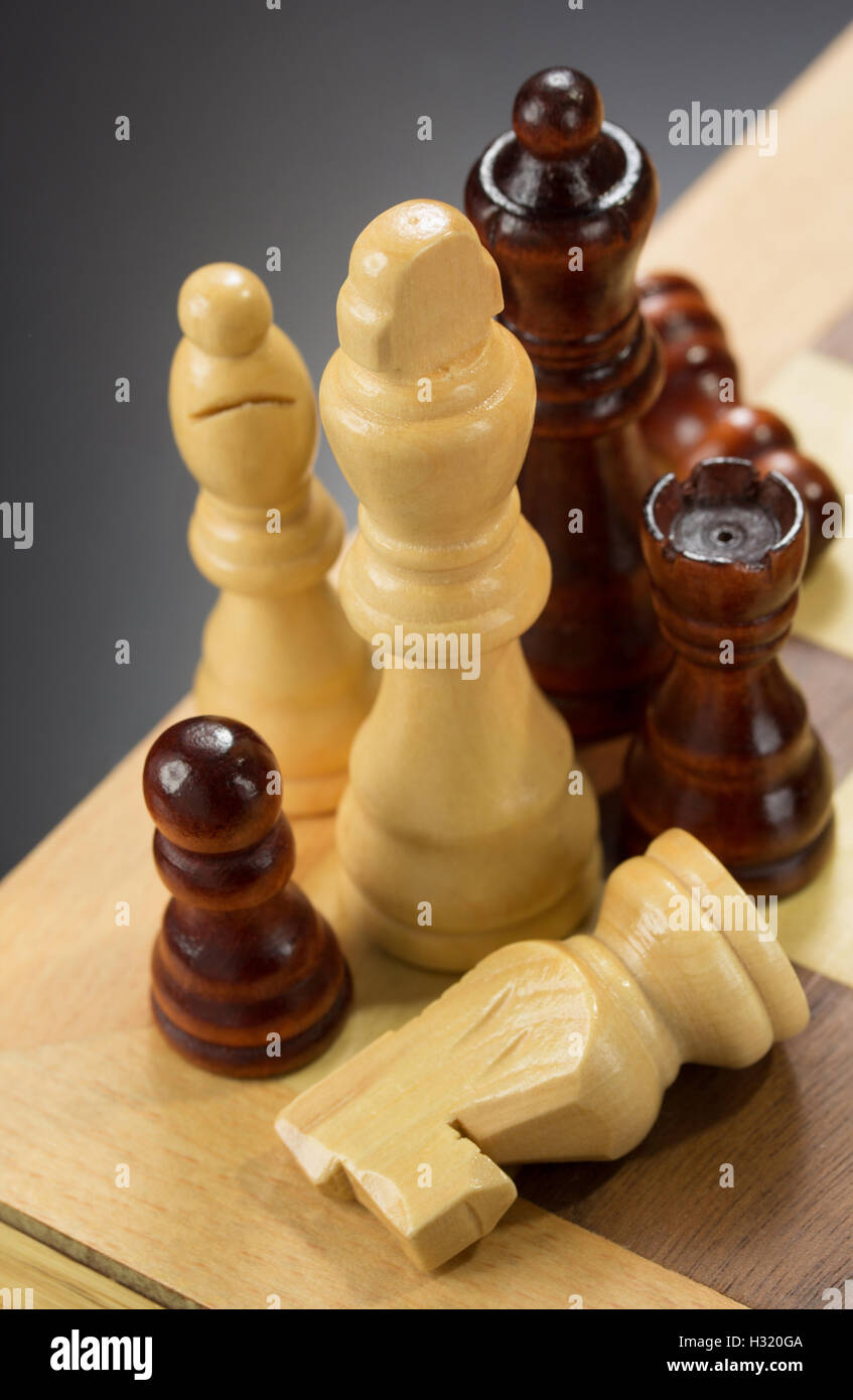 chess figures and board at black background Stock Photo - Alamy