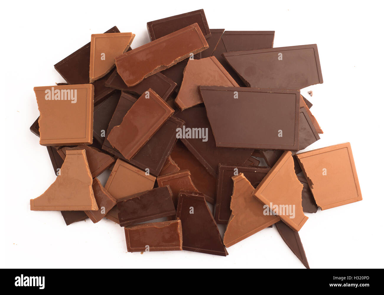 Broken different chocolate bars in many colors and flavors isolated on ...