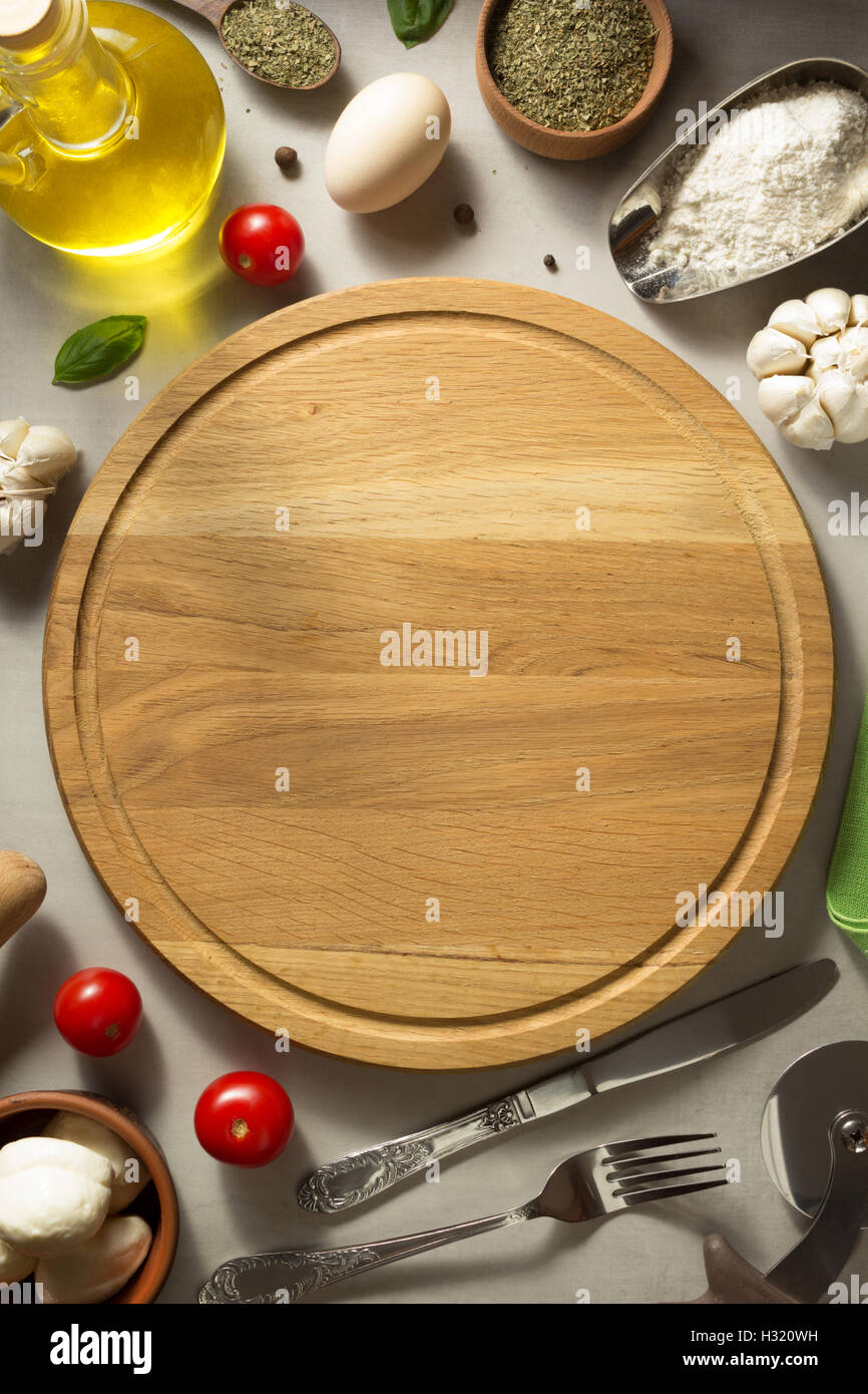 pizza cutting board at table Stock Photo - Alamy