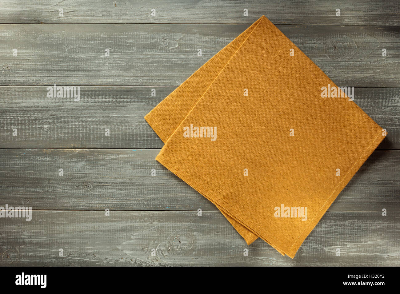 cloth napkin on wooden table background Stock Photo - Alamy