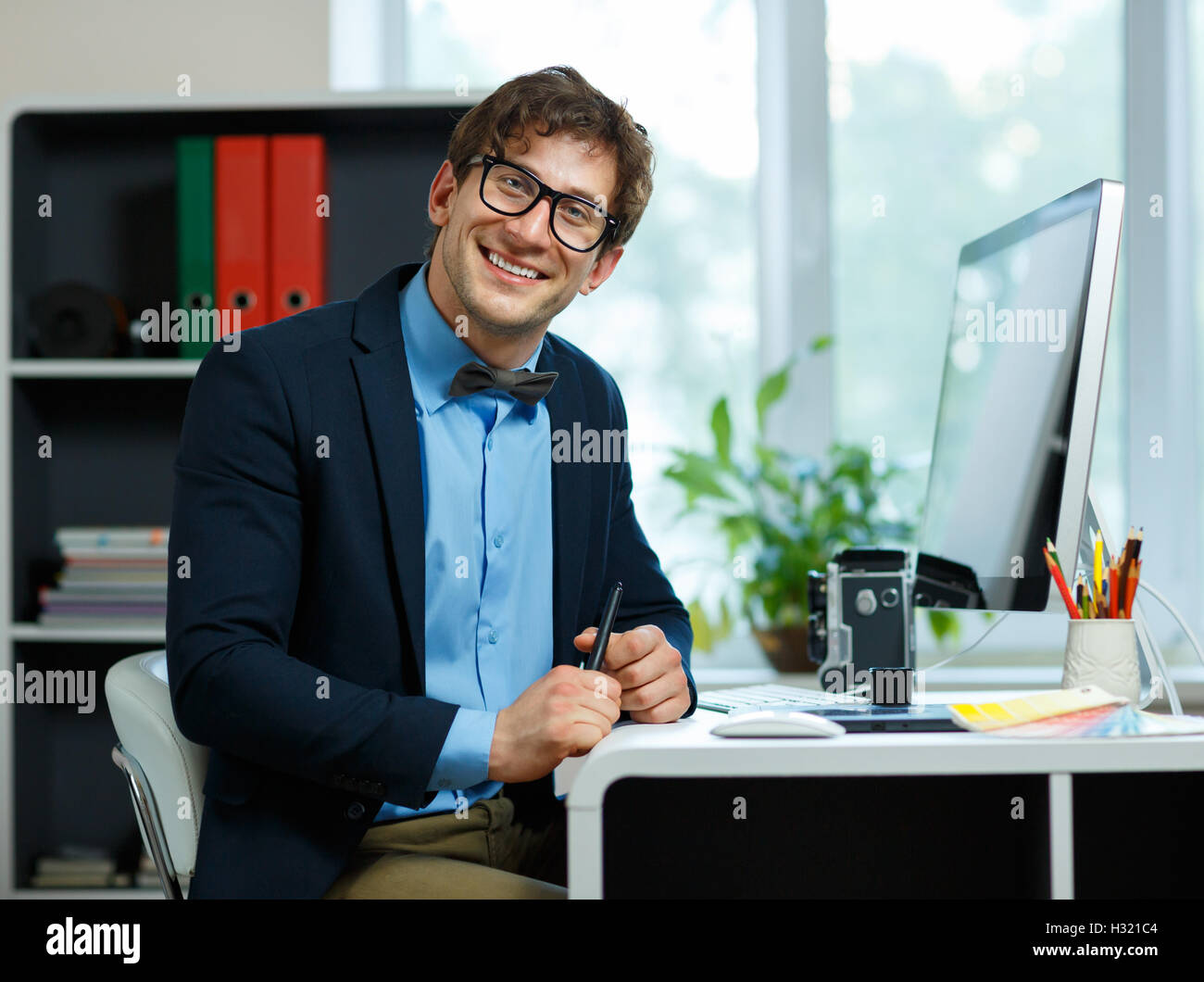 Handsome young man working from home office - modern business concept ...