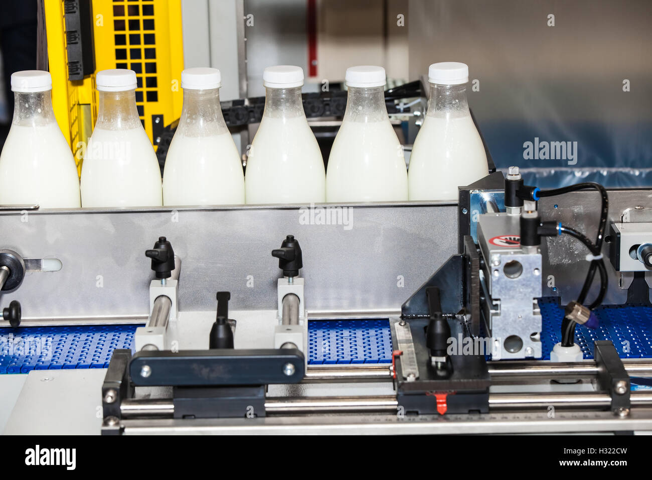 Packaging milk bottles line Stock Photo - Alamy
