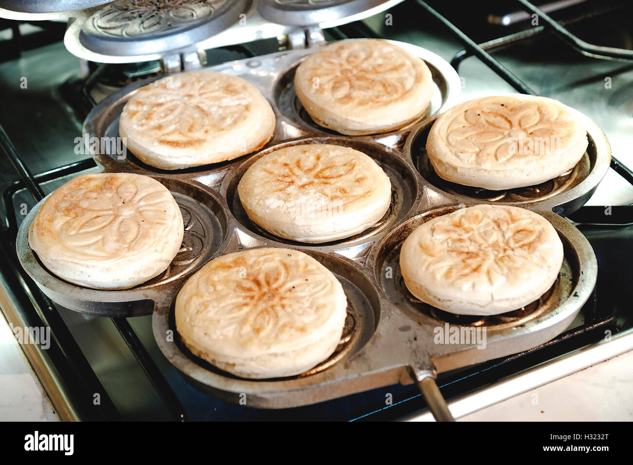 cooking Tigelle special pan Tigelliera, traditional food Bologna Modena ...