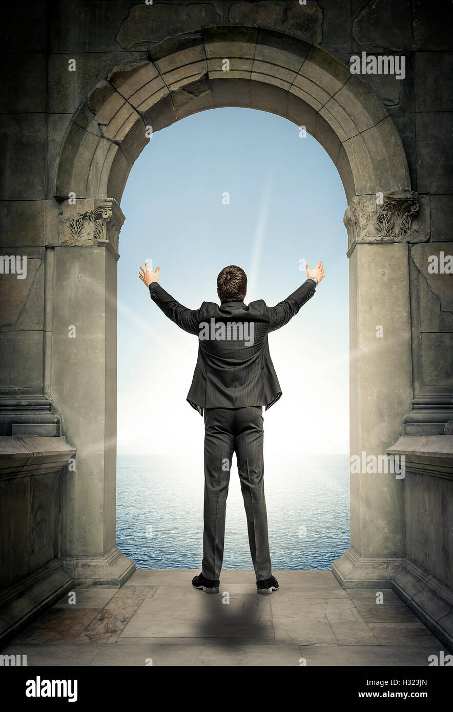 Businessman standing with his hand raised hi-res stock photography and ...