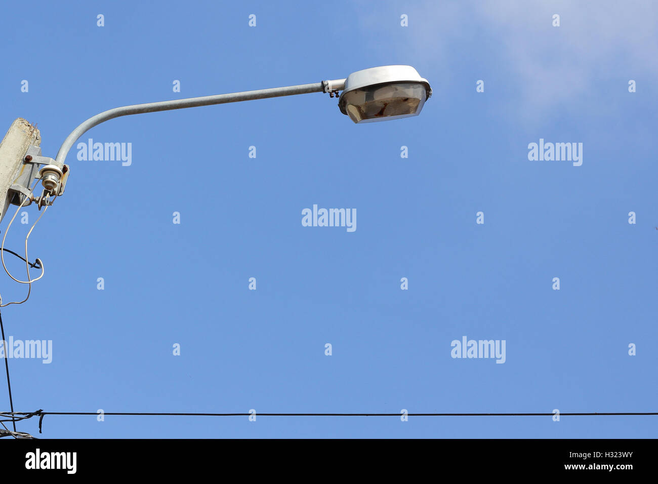 Lighting poles on blue sky background Stock Photo - Alamy