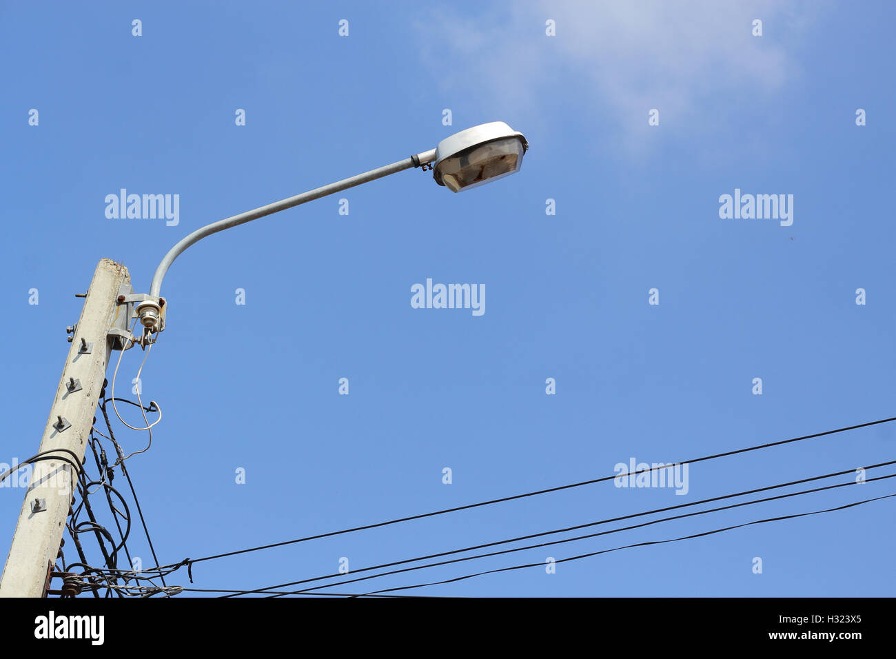 Lighting poles on blue sky background Stock Photo - Alamy