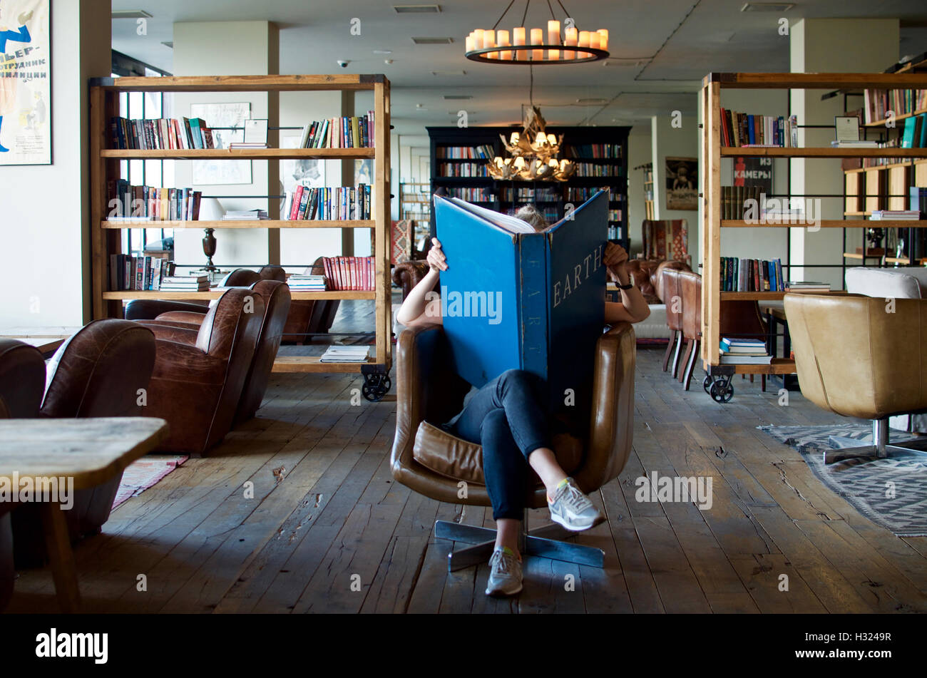 Reading a big book Stock Photo - Alamy