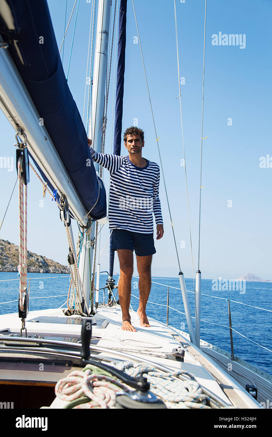 Young man posing for sailboat Stock Photo - Alamy