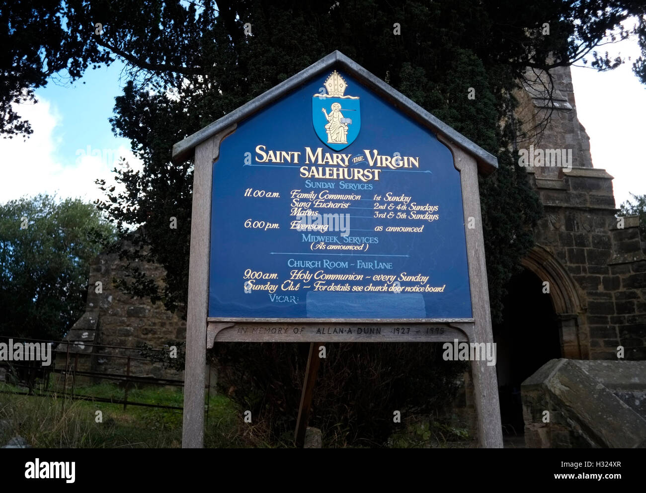 A sign is seen outside Saint Mary's Church in Salehurst, East Sussex ...