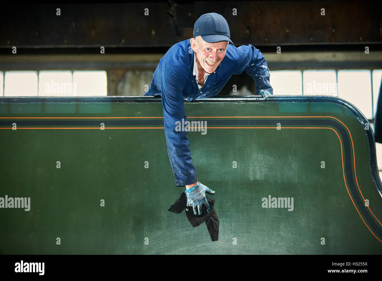 A man polishes the side of a steam engine at Didcot Railway Centre as ...