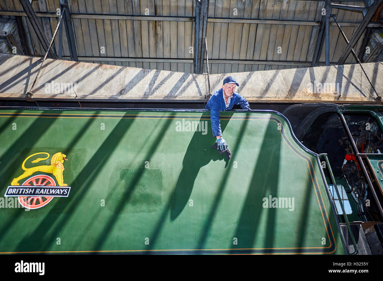 A man polishes the side of a steam engine at Didcot Railway Centre as ...