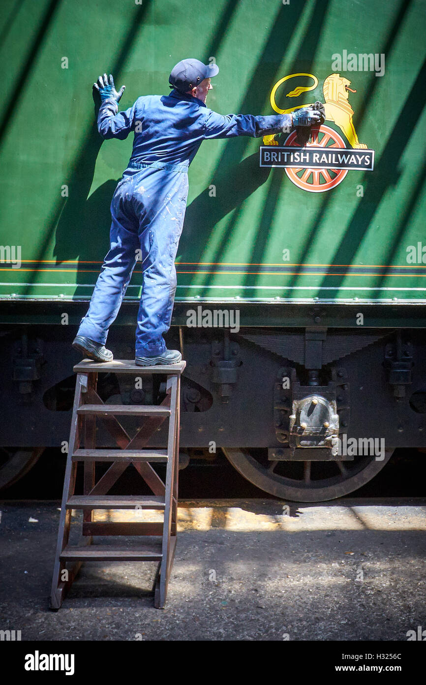 A man polishes the side of a steam engine at Didcot Railway Centre as ...