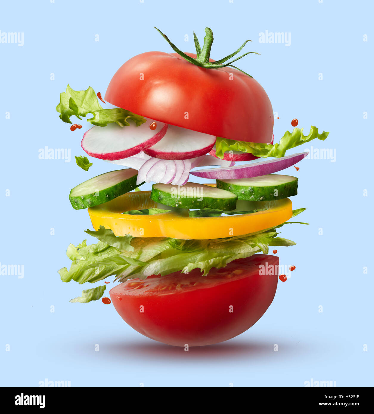 Flying Ingredients Of Vegan Burger Isolated On Blue Concept Idea For flying-ingredients-of-vegan-burger-isolated-on-blue-concept-idea-for