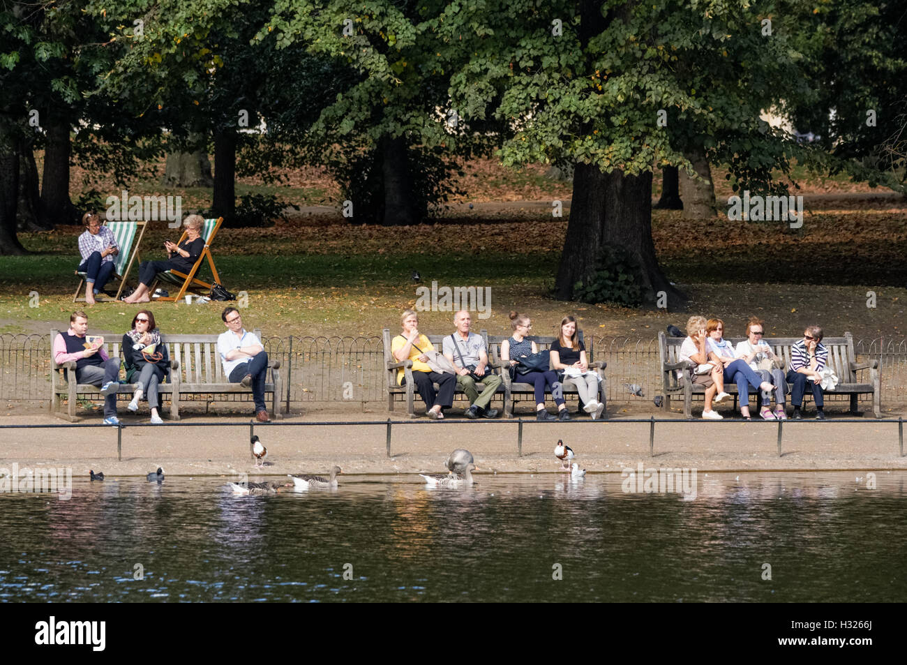 People enjoying warm September weather in St James's Park, London ...
