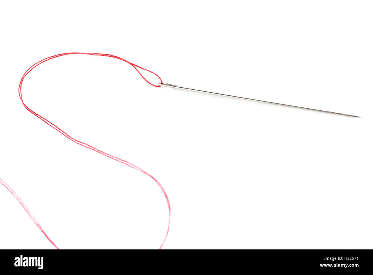 Small needle with thread isolated over the white background Stock Photo ...