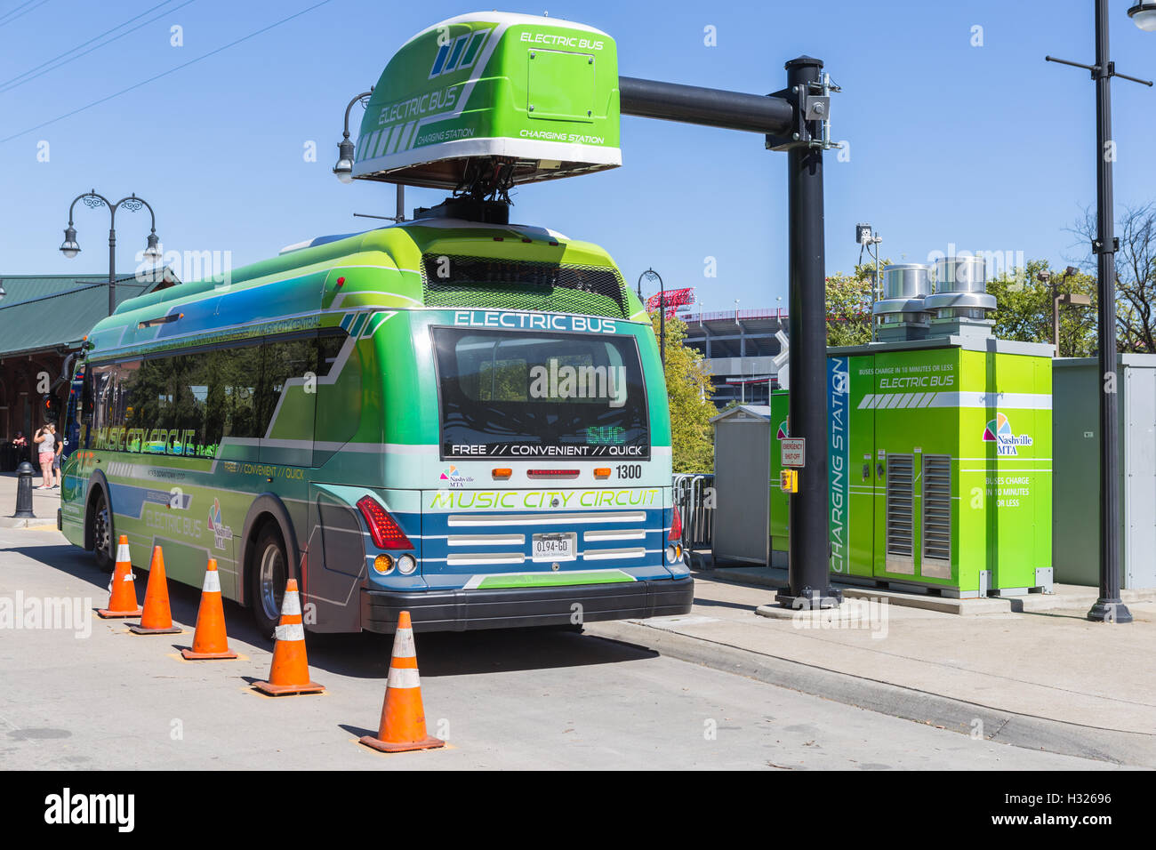 An electric Music City Circuit circulator bus charges at a bus charging ...