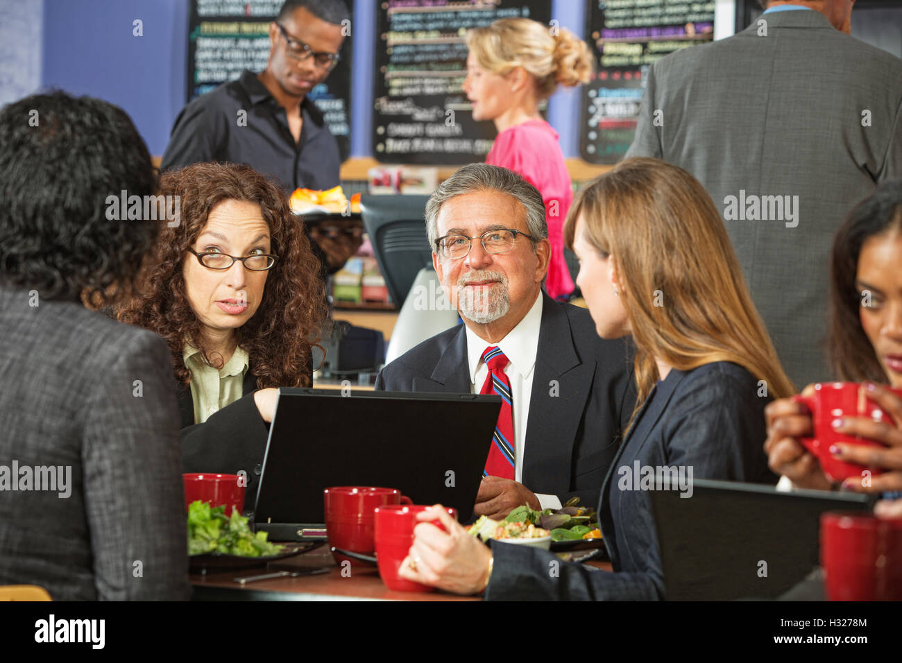 Group of Business People in Cafe Stock Photo - Alamy