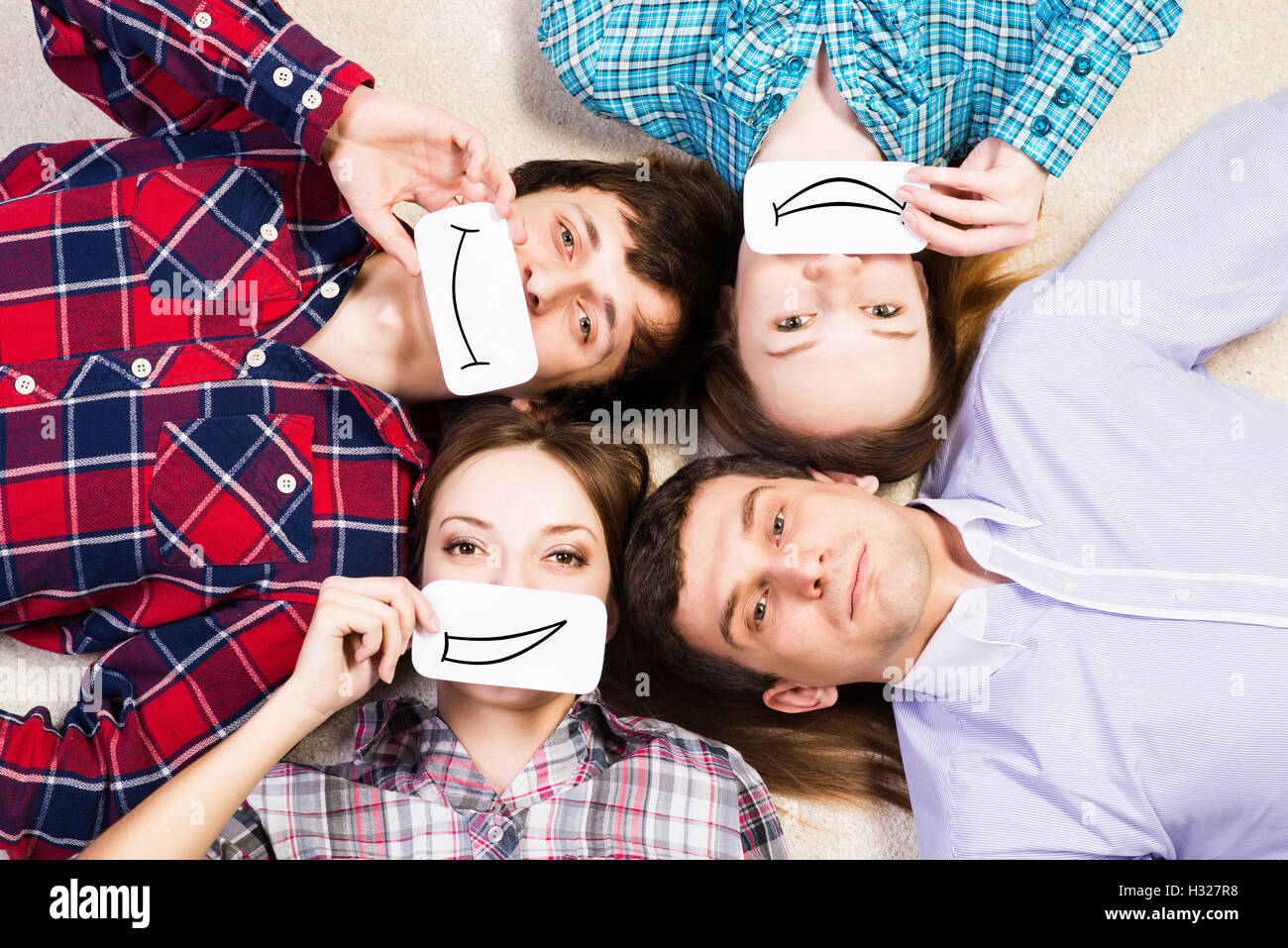 four young men lie together Stock Photo - Alamy