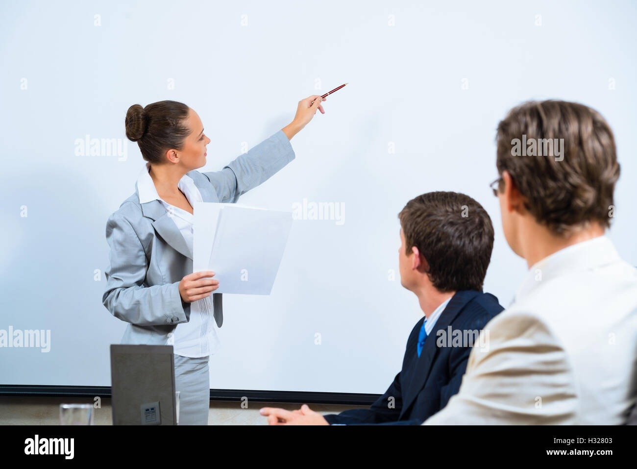 Business woman showing a presentation Stock Photo - Alamy