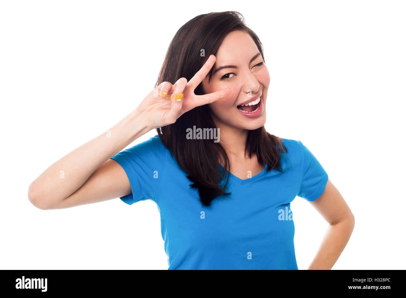 Excited girl doing victory sign on eye Stock Photo - Alamy