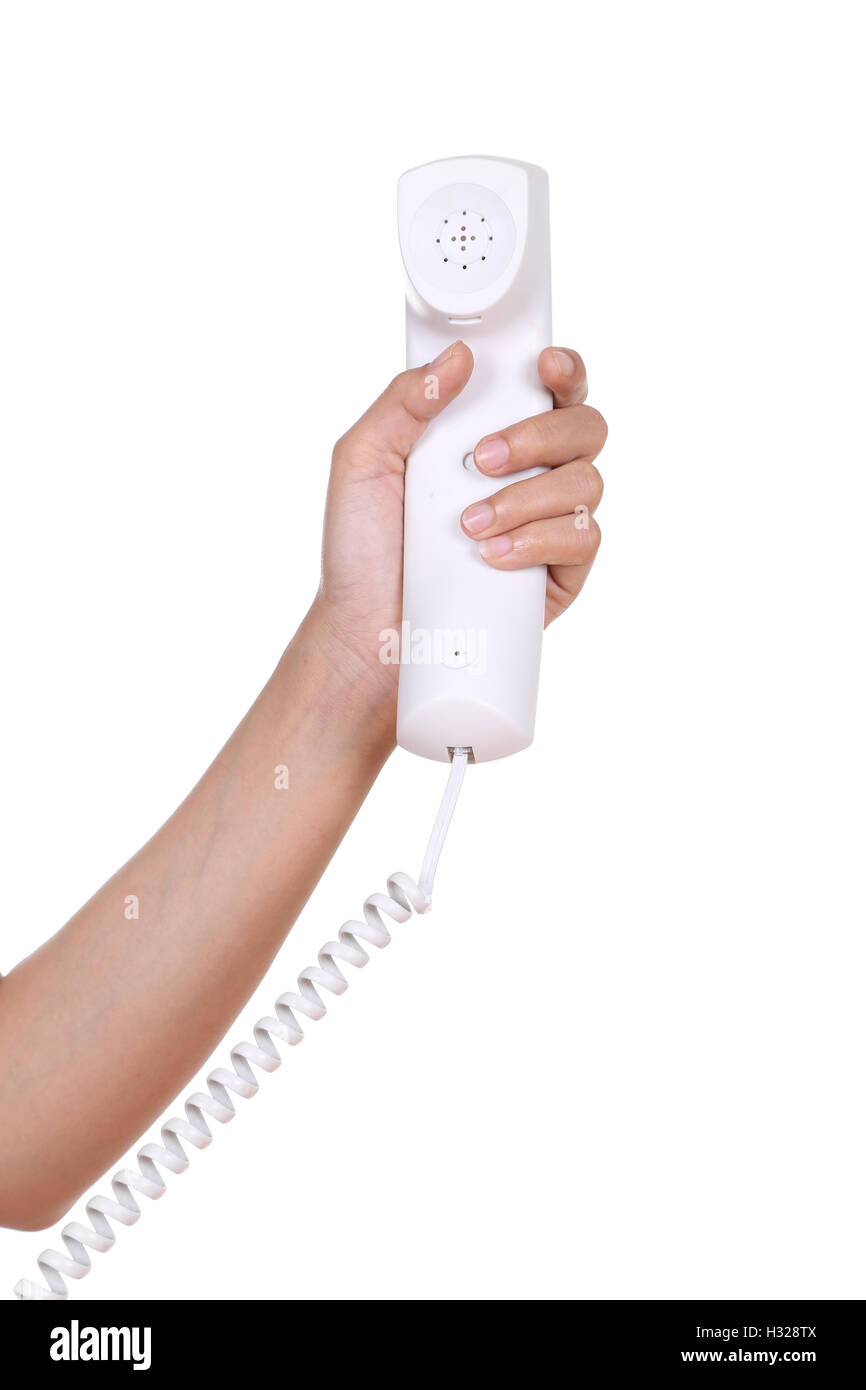 Hand holding white telephone tube Stock Photo - Alamy